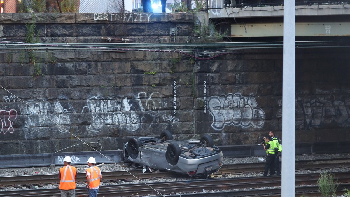 Car Flips Onto Train Tracks in Boston, Four Injured – NBC Boston
