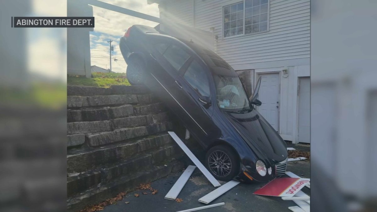 Car left in drive crashes through fence, down embankment into someone’s ...