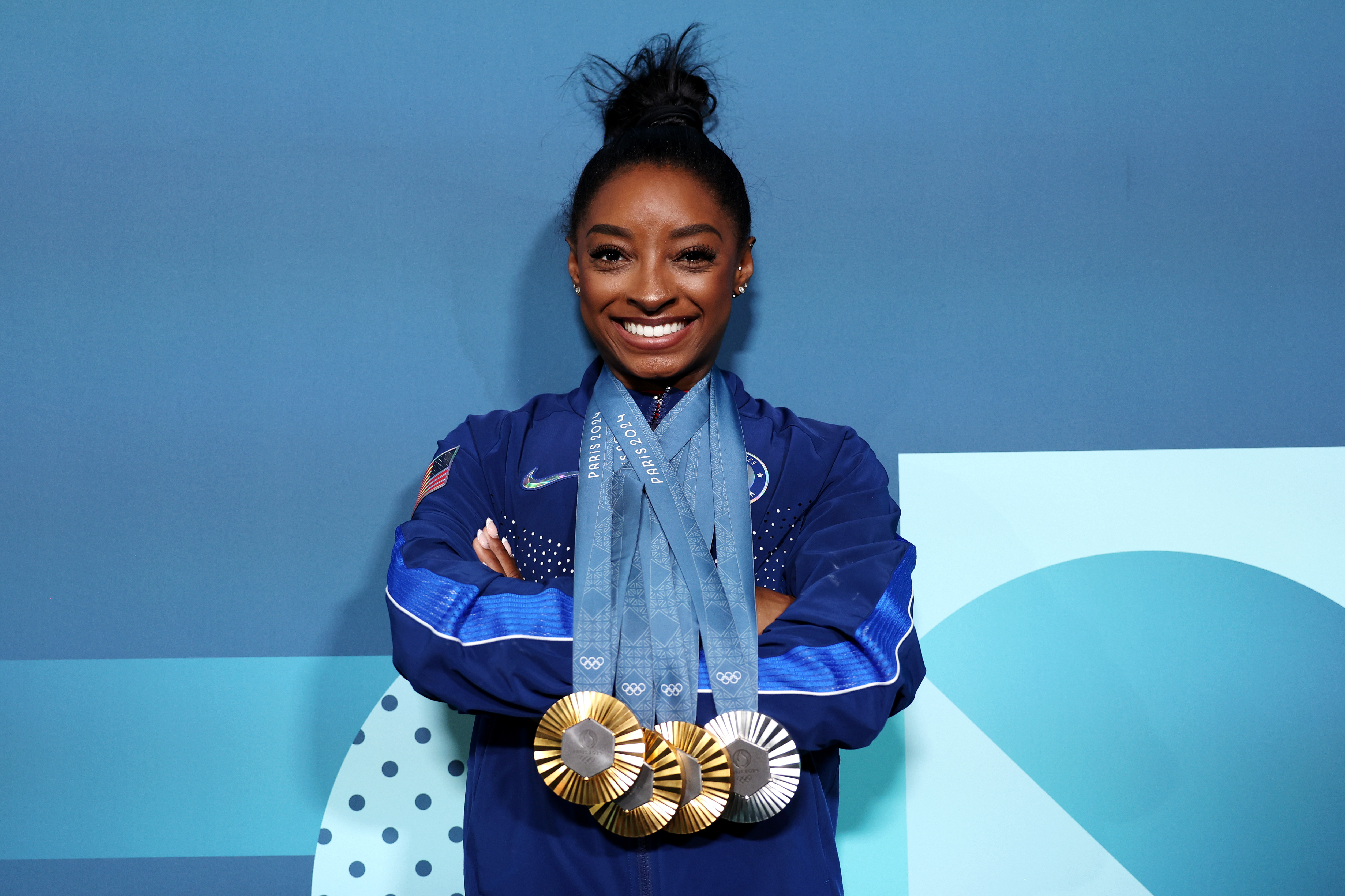 Simone Biles poses with her 11 Olympic medals in new photos – NBC Boston