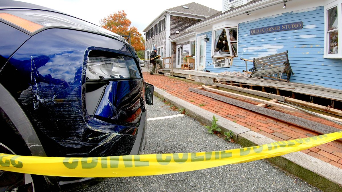 Sandwich, MA Merchants Square: Man pinned between car and building ...